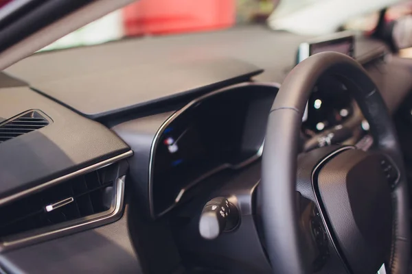 Dark luxury car Interior - steering wheel, shift lever and dashboard ...