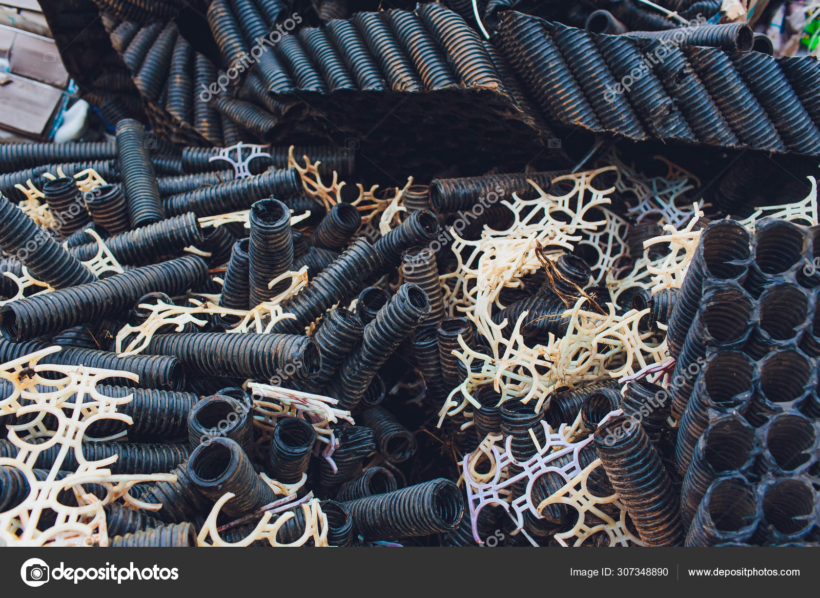 Plastic pipe and materials for constructions waste sorting. Stock Photo ...