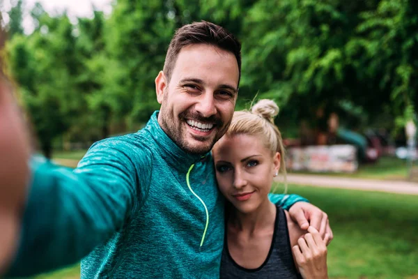 Fit couple making selfie. - Stock Image - Everypixel