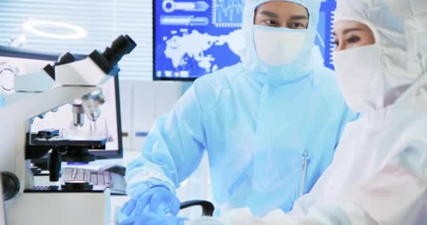 Asian scientist use microscope — Stock Video © ryanking999 #314955216