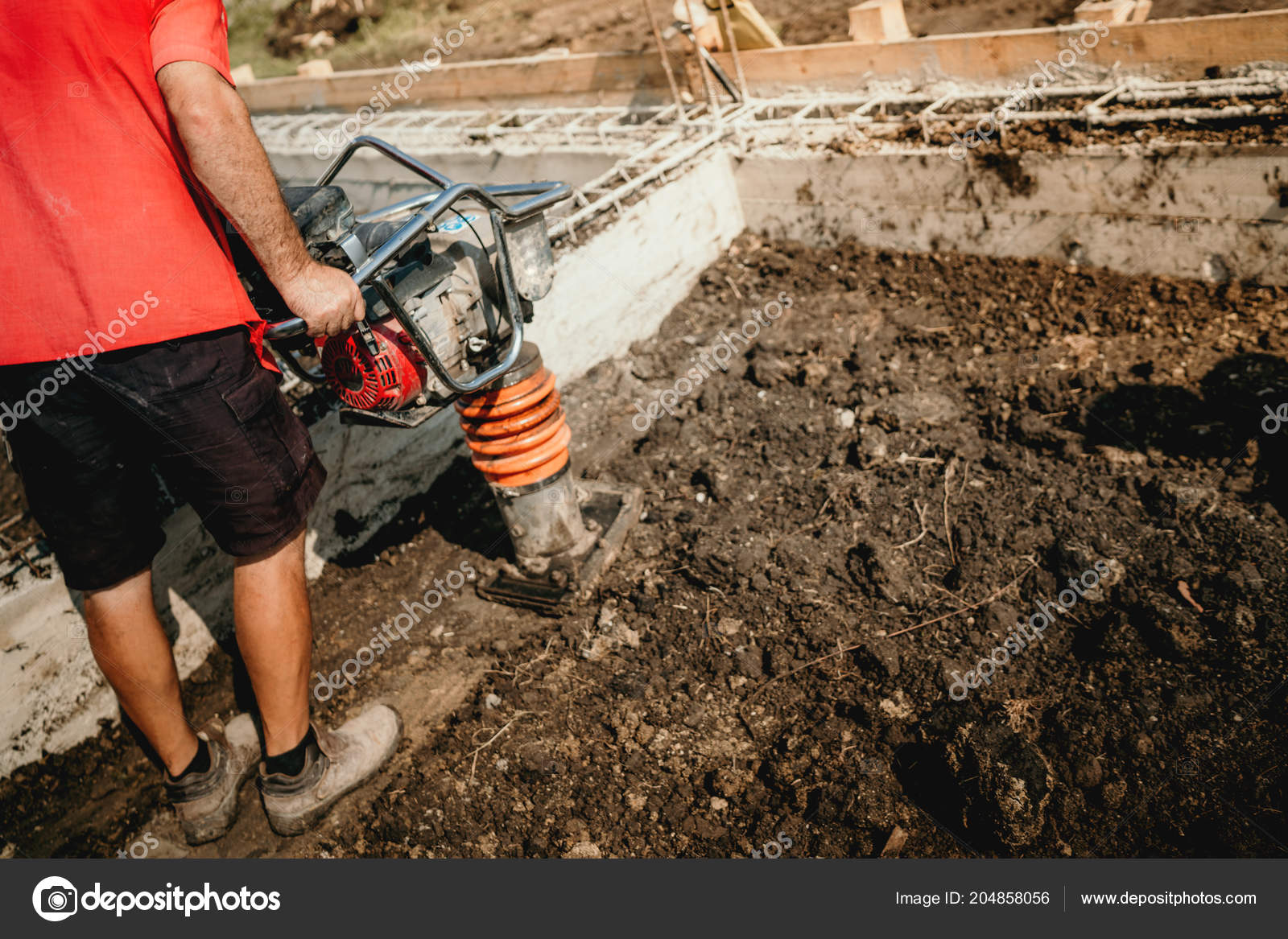 Builder Worker Compacting Soil Vibration Compaction Machine Foundation ...