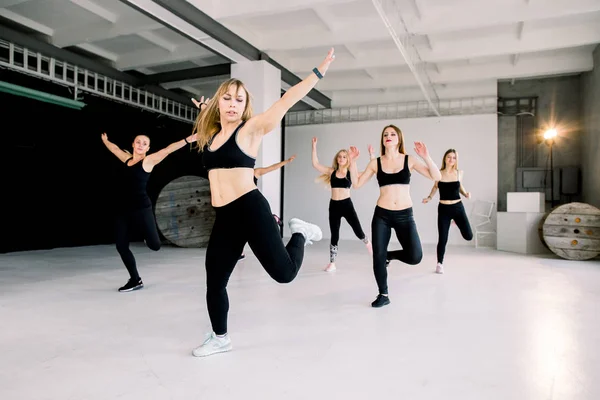 Team of women having step aerobics class - Stock Image - Everypixel