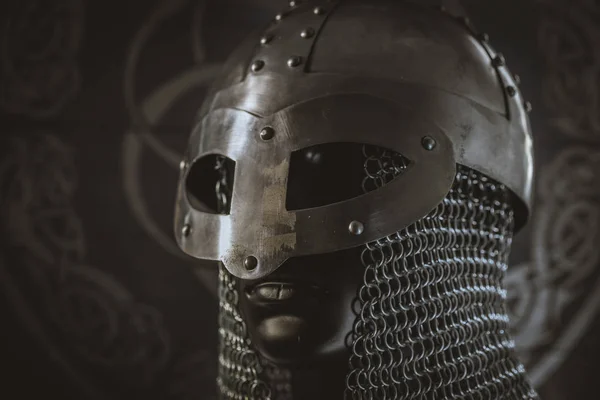 viking warrior helmet with chainmail over shield with drawings and ...