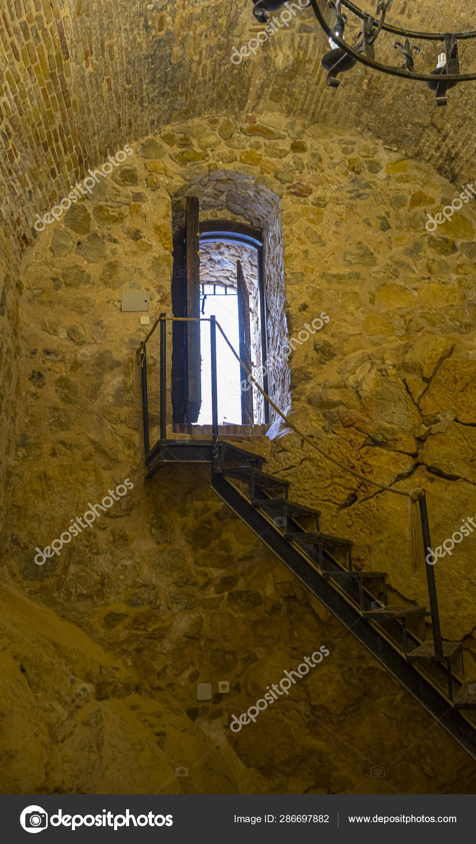 Stairs, Interior of a medieval castle in Toledo, Spain. Stone ro ...