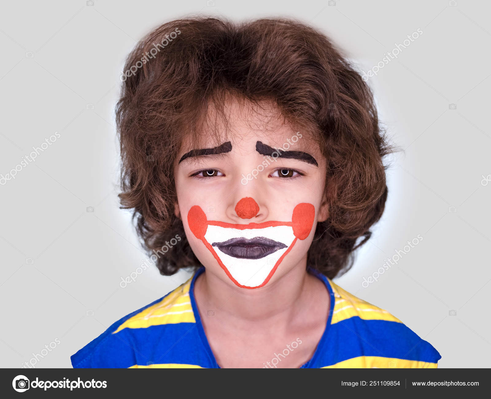 Little cute boy with facepaint like clown, pantomimic expression. April ...