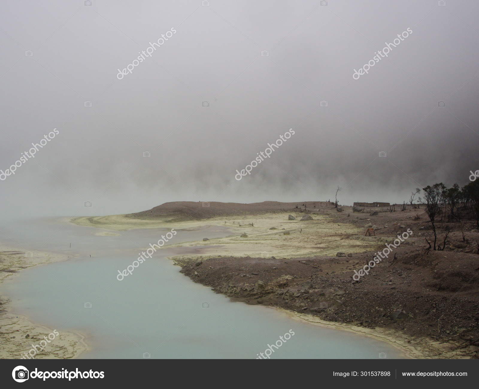 Kawah Putih is a striking crater lake and tourist spot in a volc ...