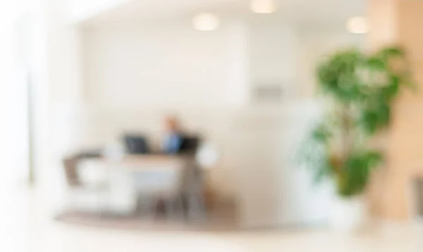 Blurred office background , office worker on the computer — Stock Photo ...
