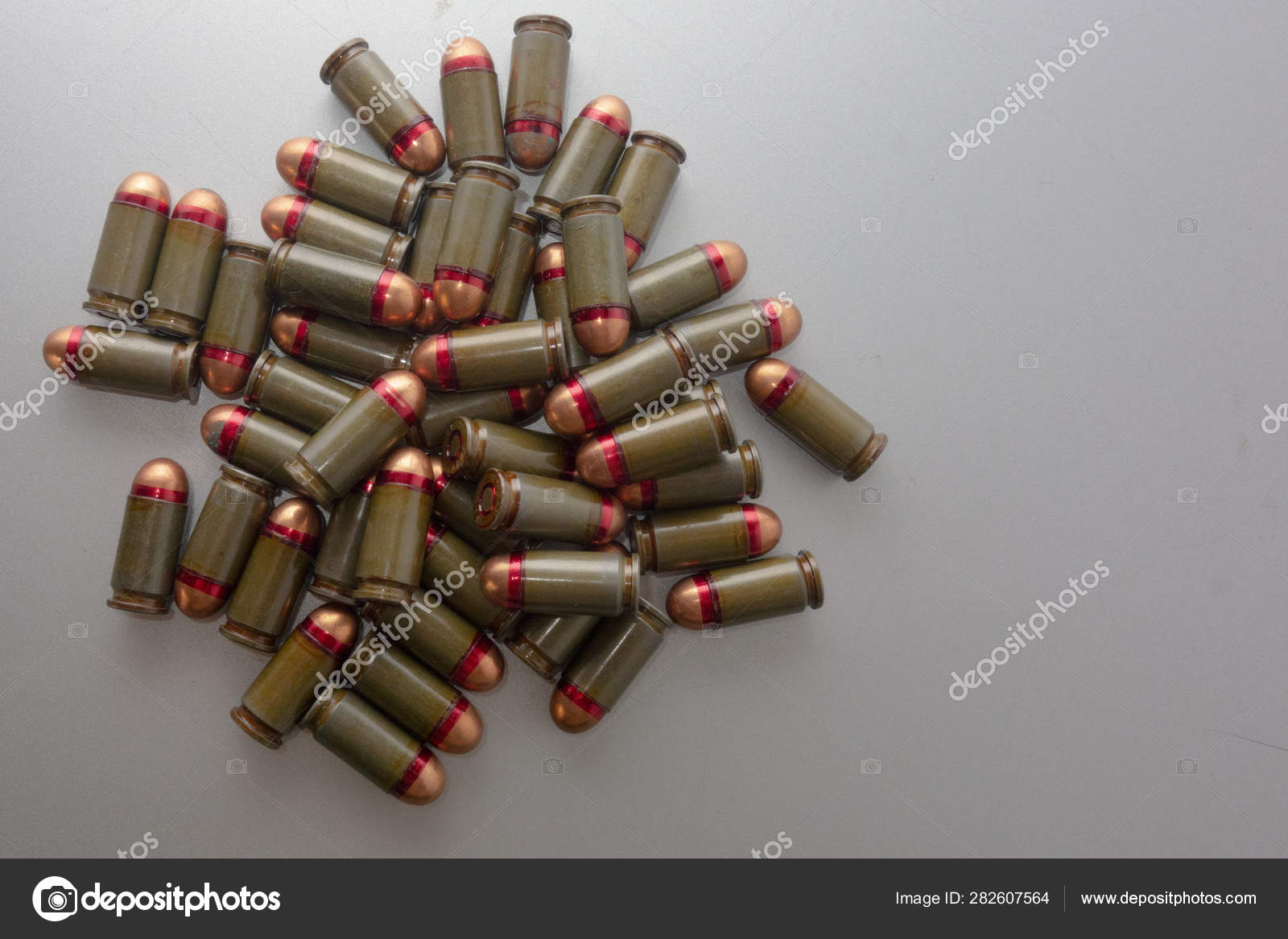 Cartridges bulk close up images. Bullets in shells for gun are p ...