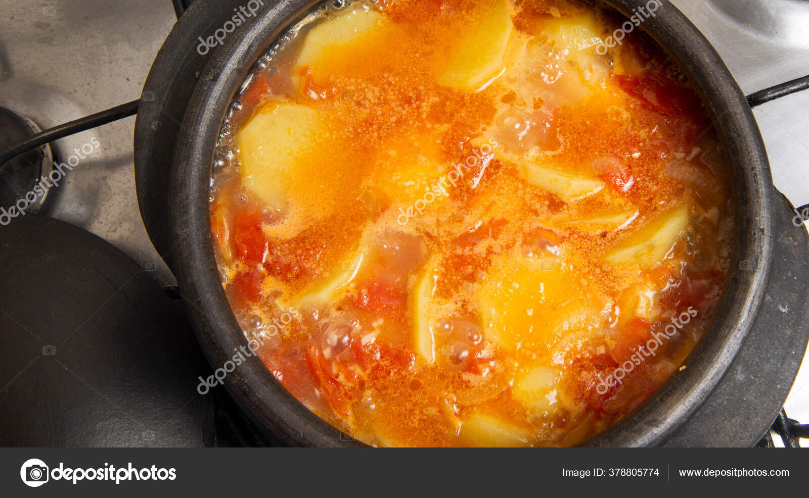 Fish Being Cooked Clay Pot Tomato Sauce Stock Photo by ©celsopupo 378805774
