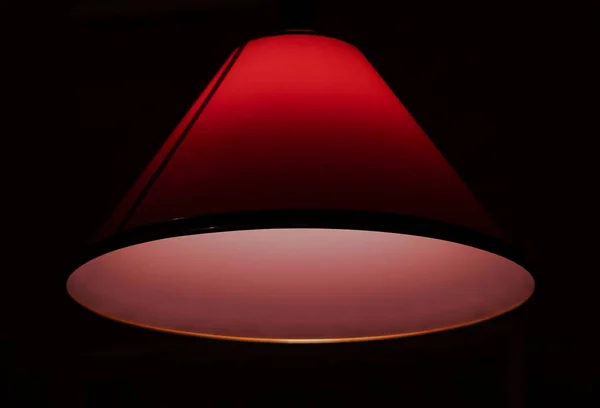 Red lamp isolated on black - Stock Image - Everypixel