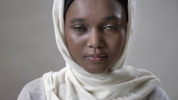 Young Sad African Muslim Girl In Hijab Is Looks Up And Watching At