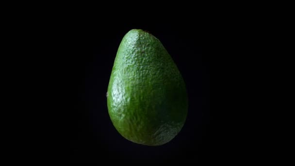Illustration of green avocado fastly spinning counterclockwise on black ...