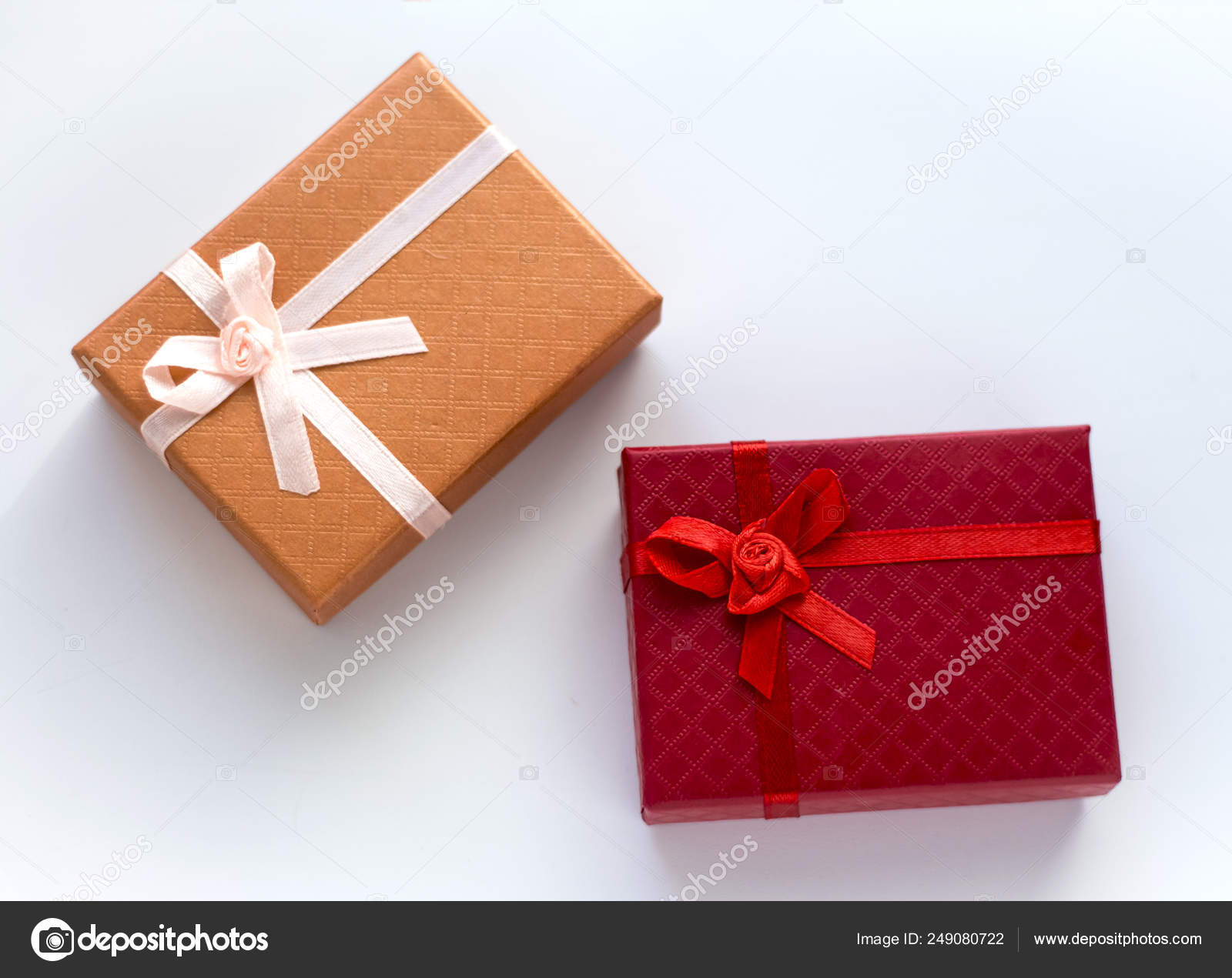 Two gift boxes in red and orange on a white background Stock Photo by ...