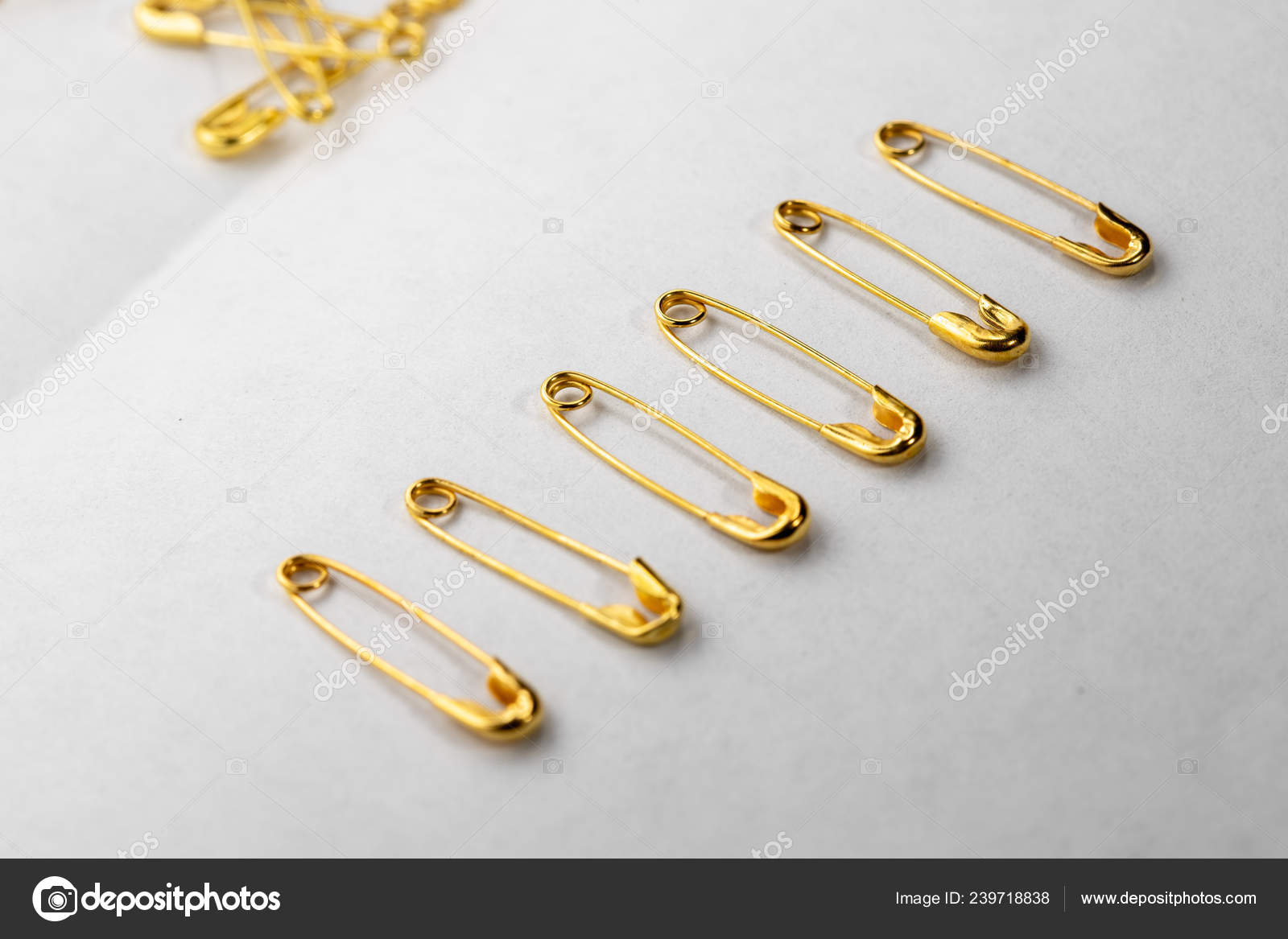 Golden Pins White Background — Stock Photo © Orlyanskiy #239718838