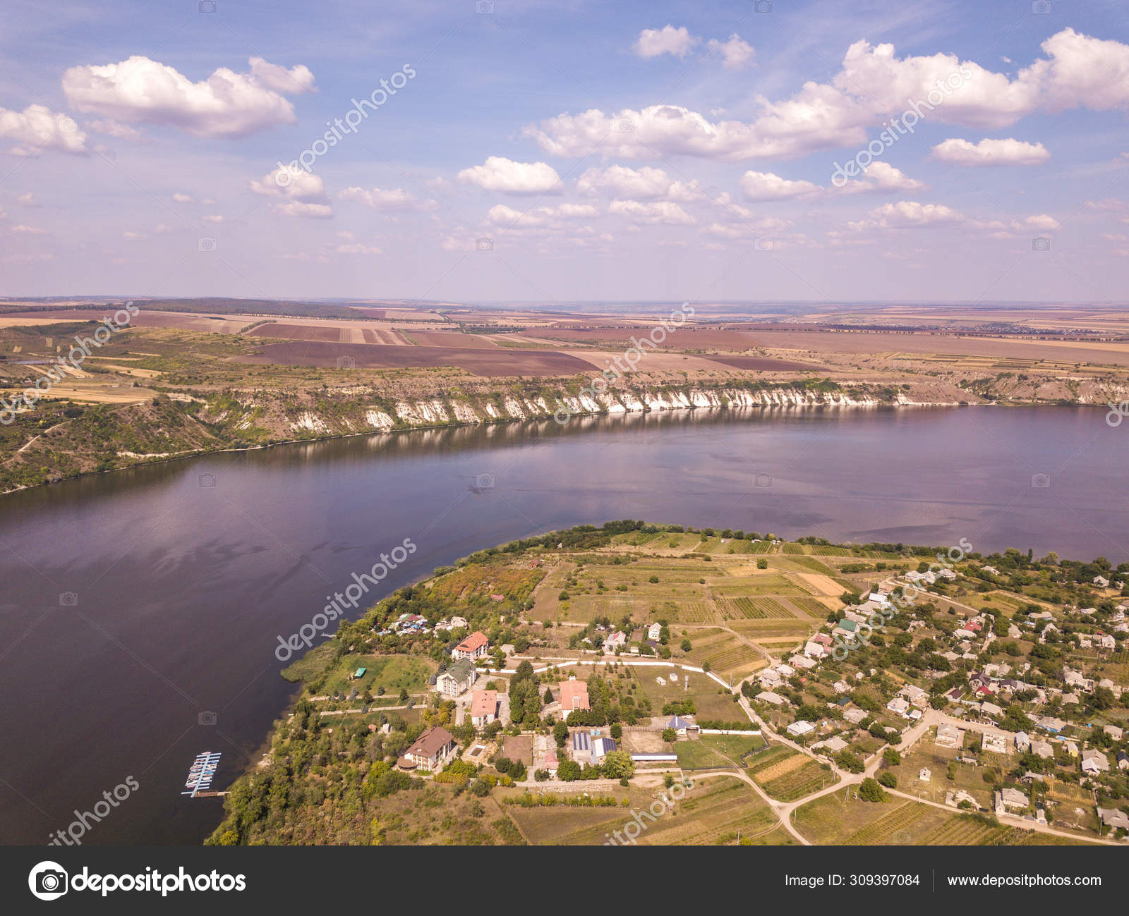 Arial view over the river and small village in autumn. Moldova republic ...
