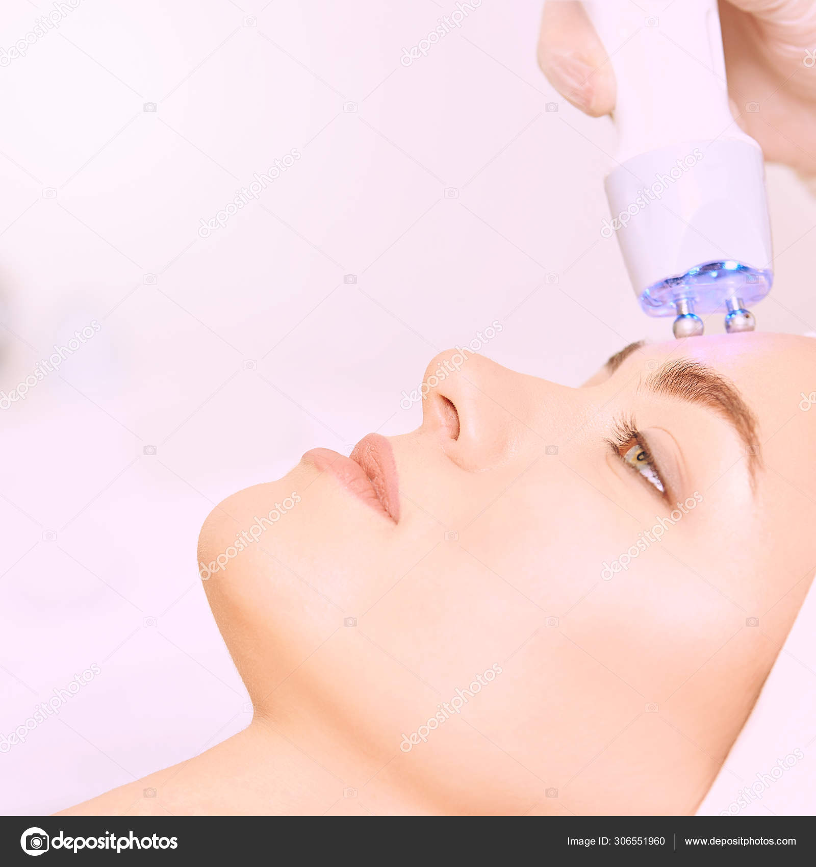 Microcurrent light esthetics procedure. Beauty girl face. Cosmetology ...