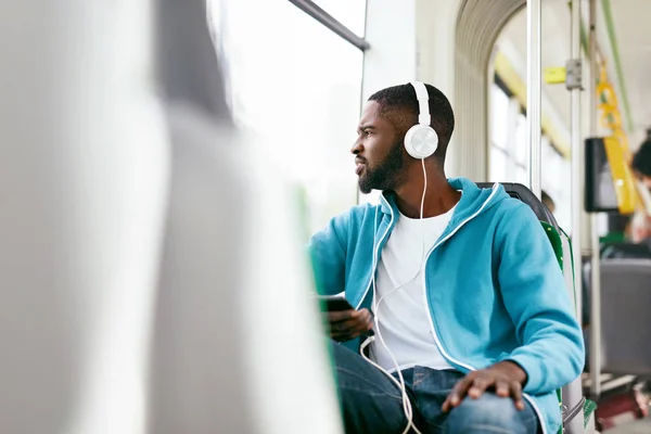 Man Riding In Bus Listening Music In Headphones - Stock Image - Everypixel