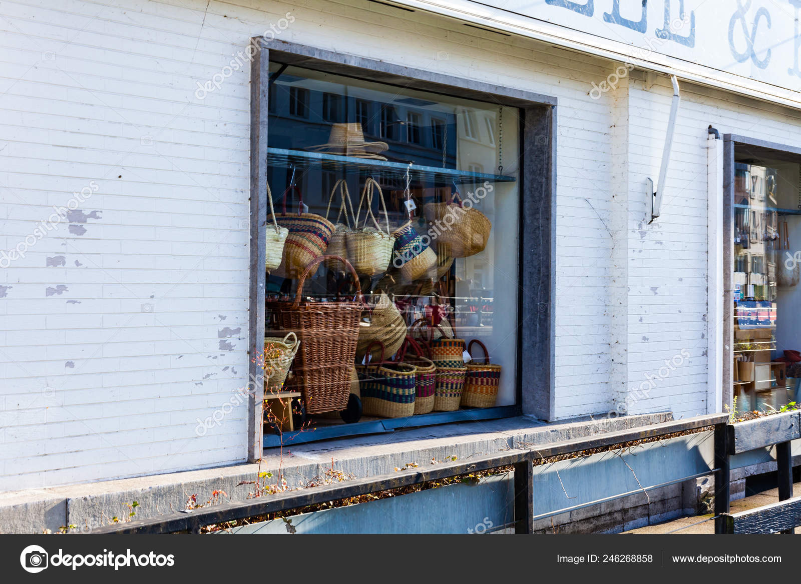 Woven bags with pruce in the shop window. Handmade woven bags shop ...