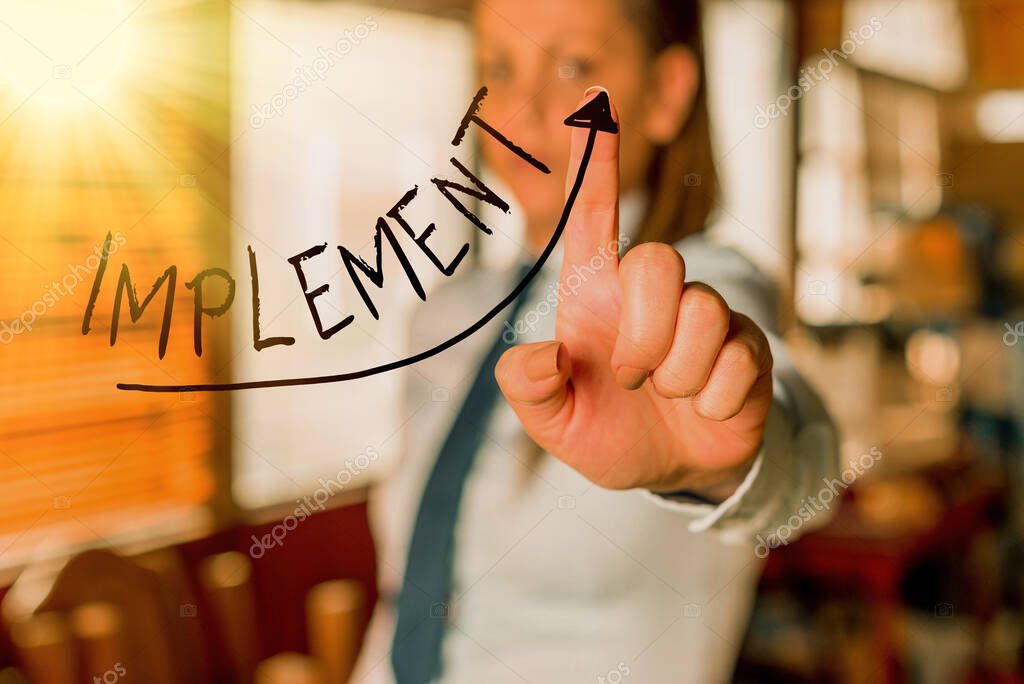 Signo de texto que muestra Implementar. Foto conceptual para ...
