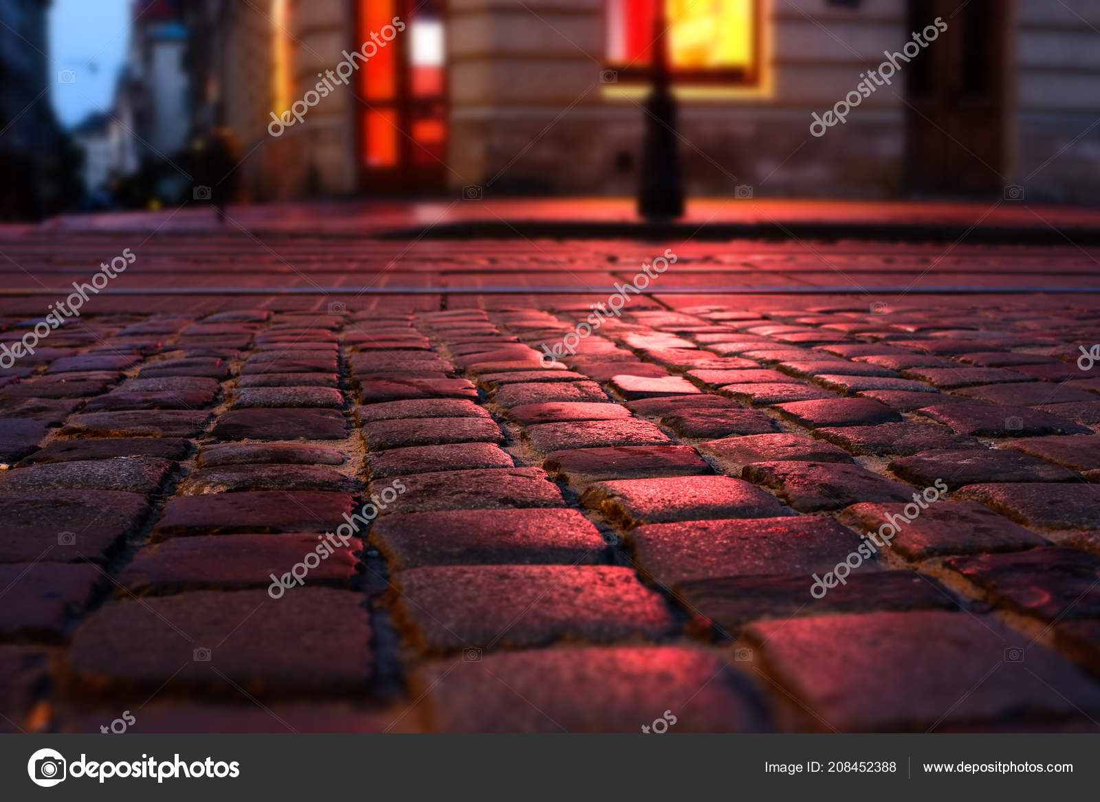 Wet Illuminated Red Light Cobblestone Street Night Stock Photo by ...