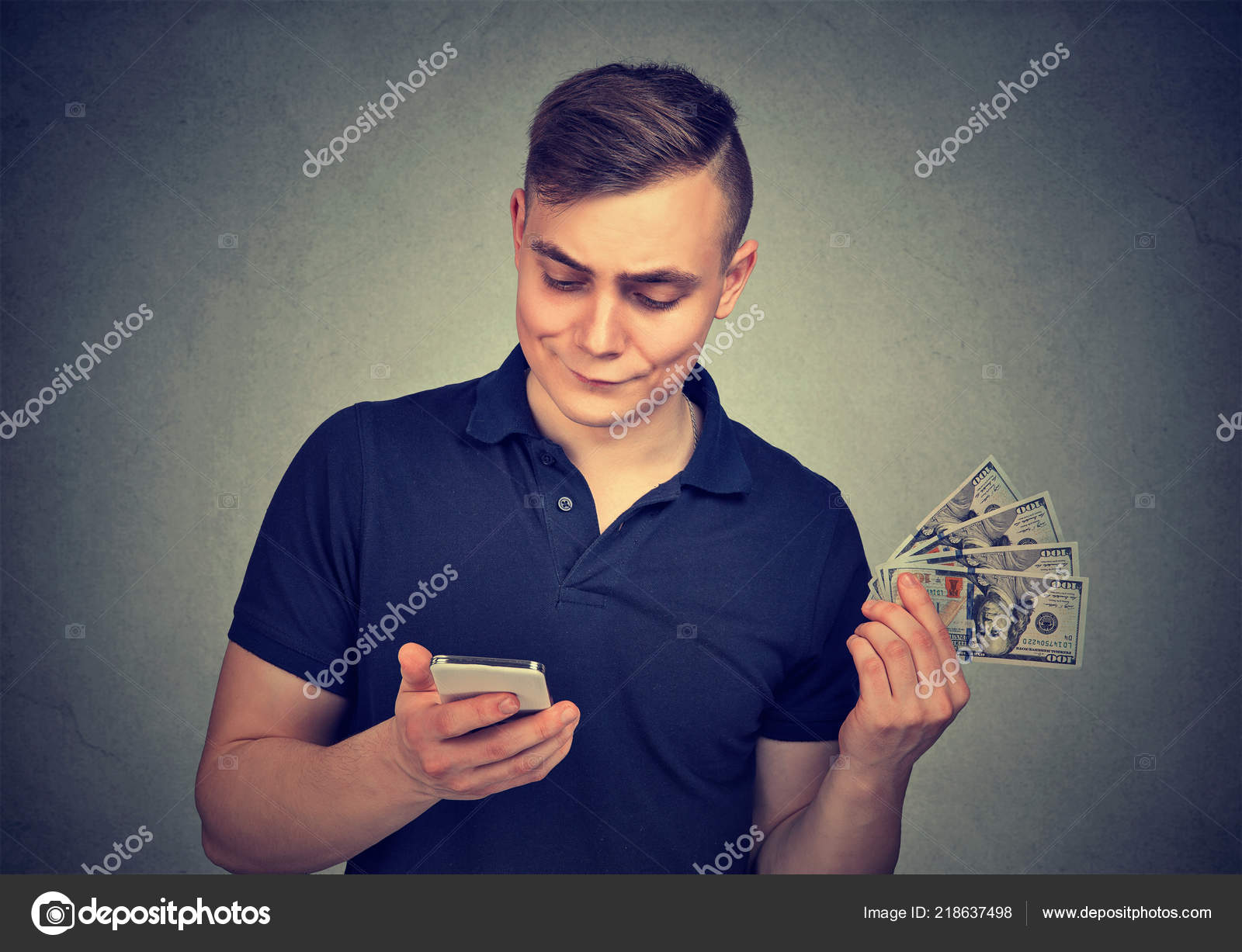 Young Casual Man Holding Dollar Bills Using Smartphone Limitless ...