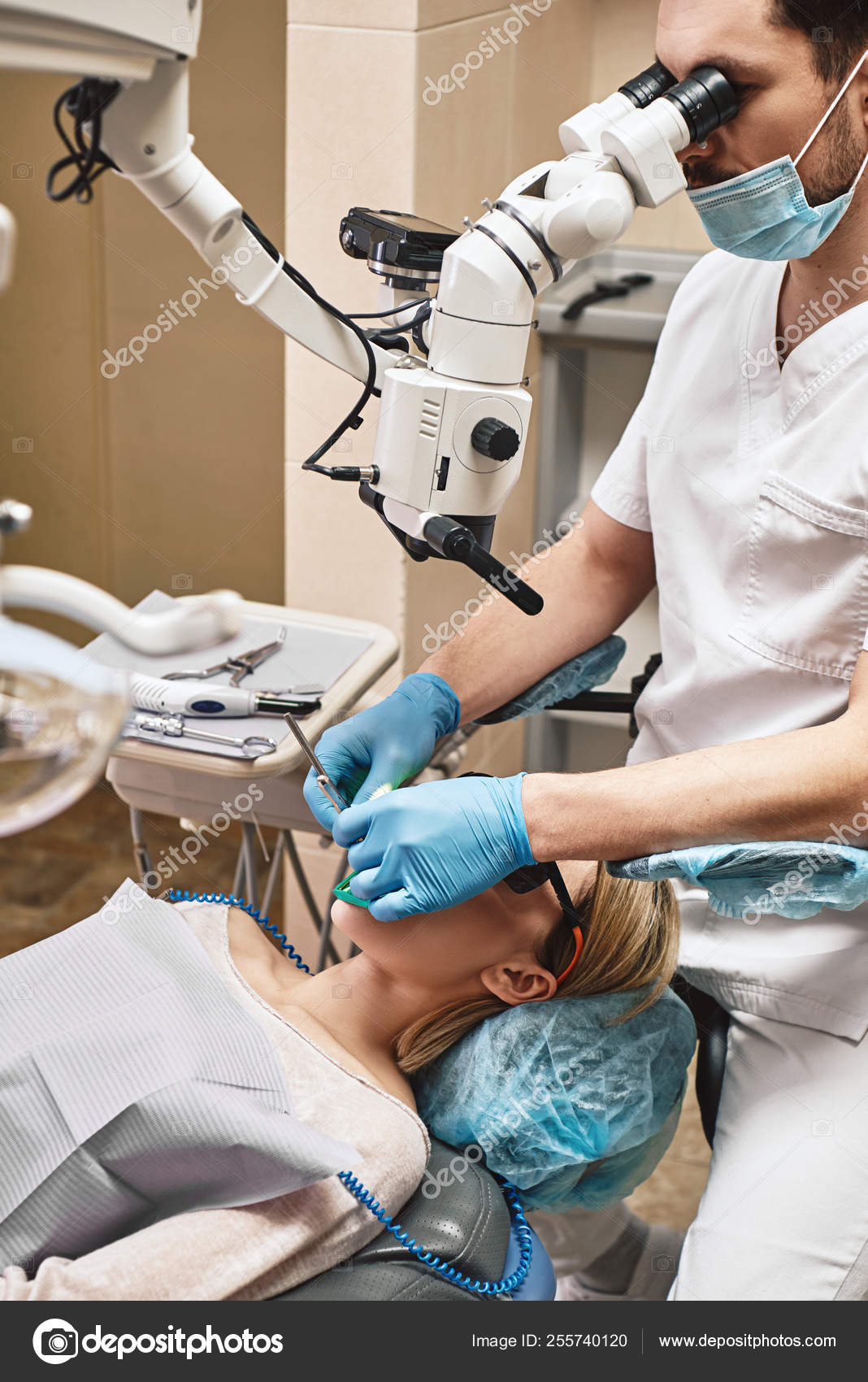 Complete care on your schedule. Male dentist look at the patient using ...