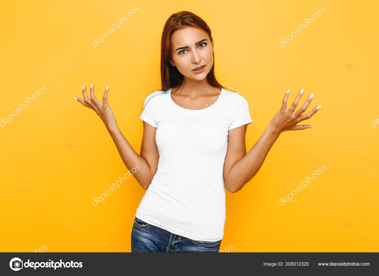 A young indignant young woman, frowning and looking indignantly at the ...