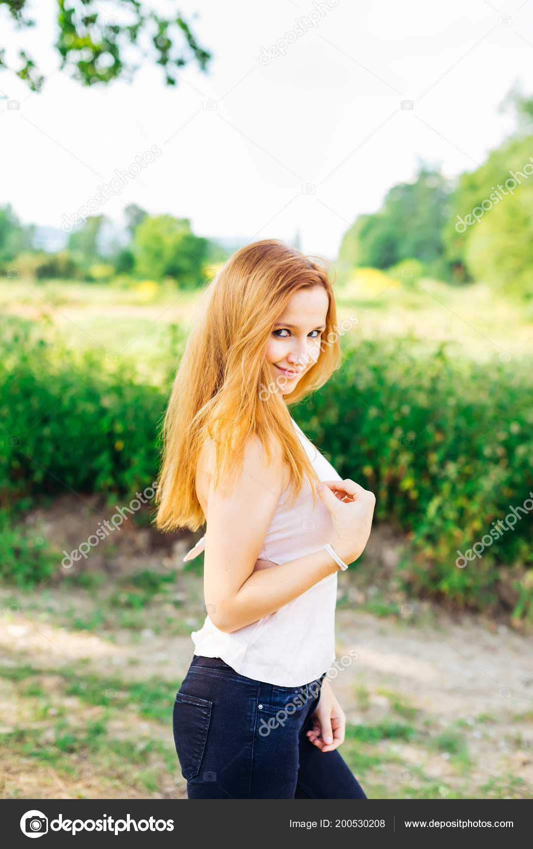 Pretty Girl Standing Sideways Background Field Playfully Looks Camera ...