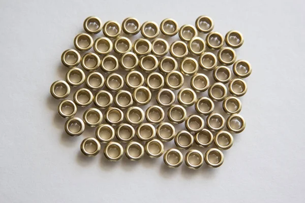 Small Gold Metal Eyelets — Stock Photo © irinaK81 #211989860