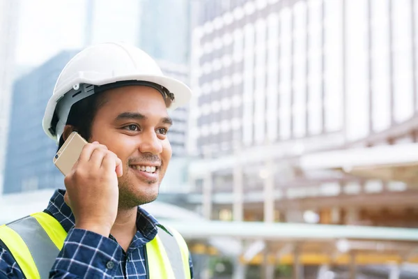 Close up front view of engineering male construction worker stand ...