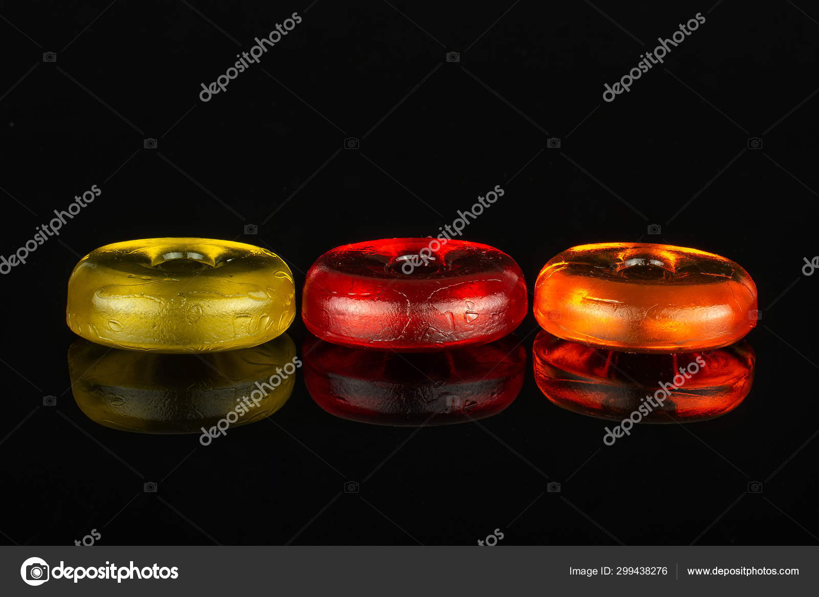 Colourful hard candy isolated on black glass Stock Photo by ©PIXbank ...