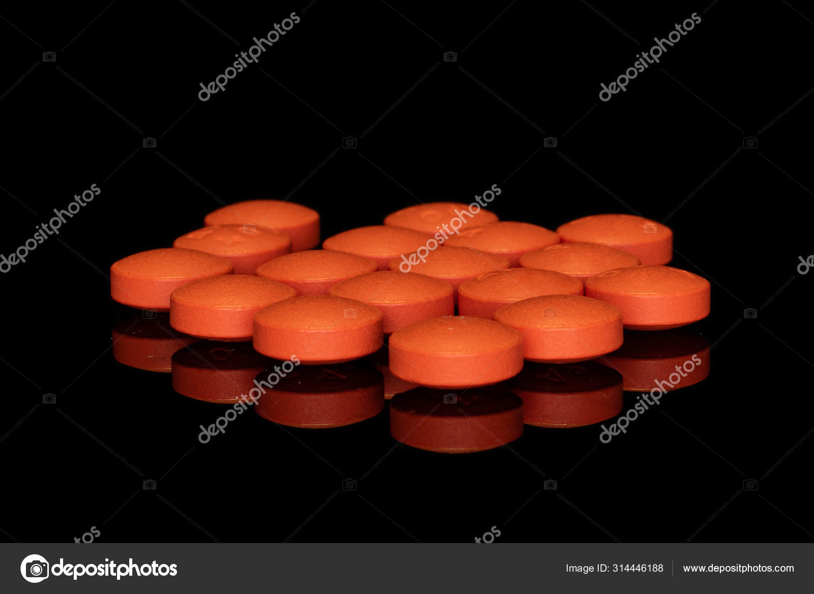 Orange pharmacy tablet isolated on black glass — Stock Photo © PIXbank ...