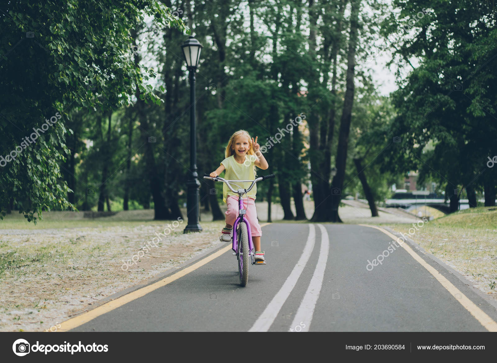 Little Child Showing Peace Sign While Riding Bicycle Road Park — Stock ...