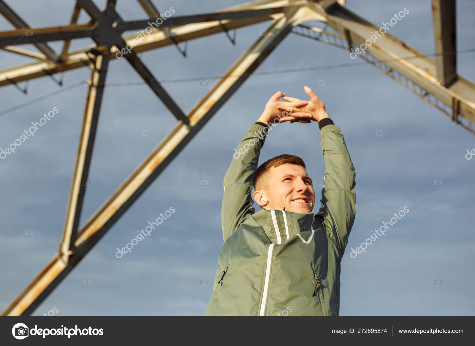 Young Man Raising His Hands Exercises Background Blue Sky Stock Photo ...