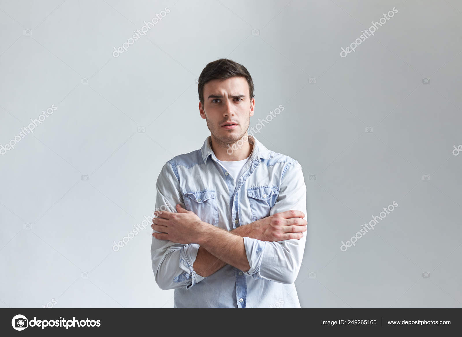 Angry Suspicious Young Caucasian Man Standing Closed Posture Sign ...