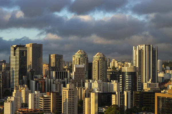 Beautiful sunset between the buildings of the big city. Sao Paulo city ...