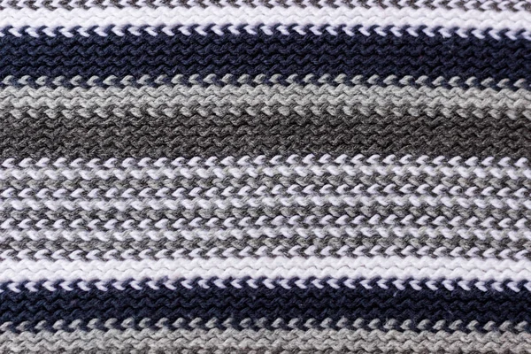 Small and dense knitted texture knitting threads of blue shades. Fine ...