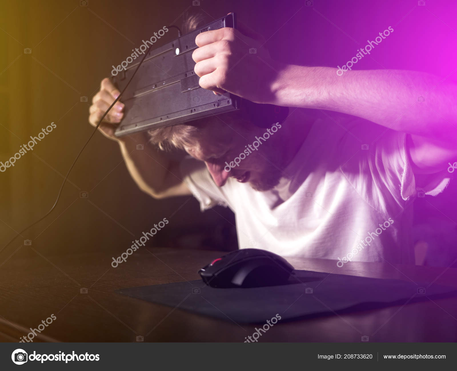 Young Bearded Man Going Crazy Mad Crashing Breaking Computer Keyboard ...