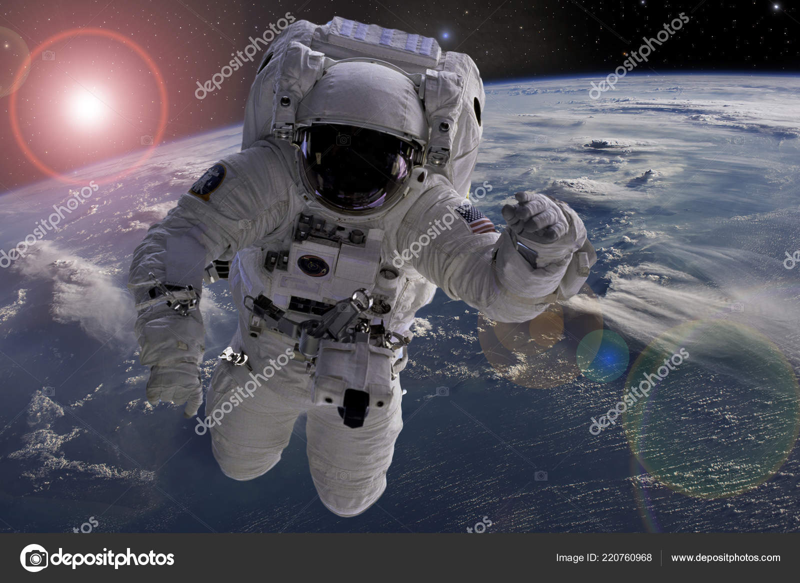 Astronaut flying in outer space near planet earth doing some work near ...