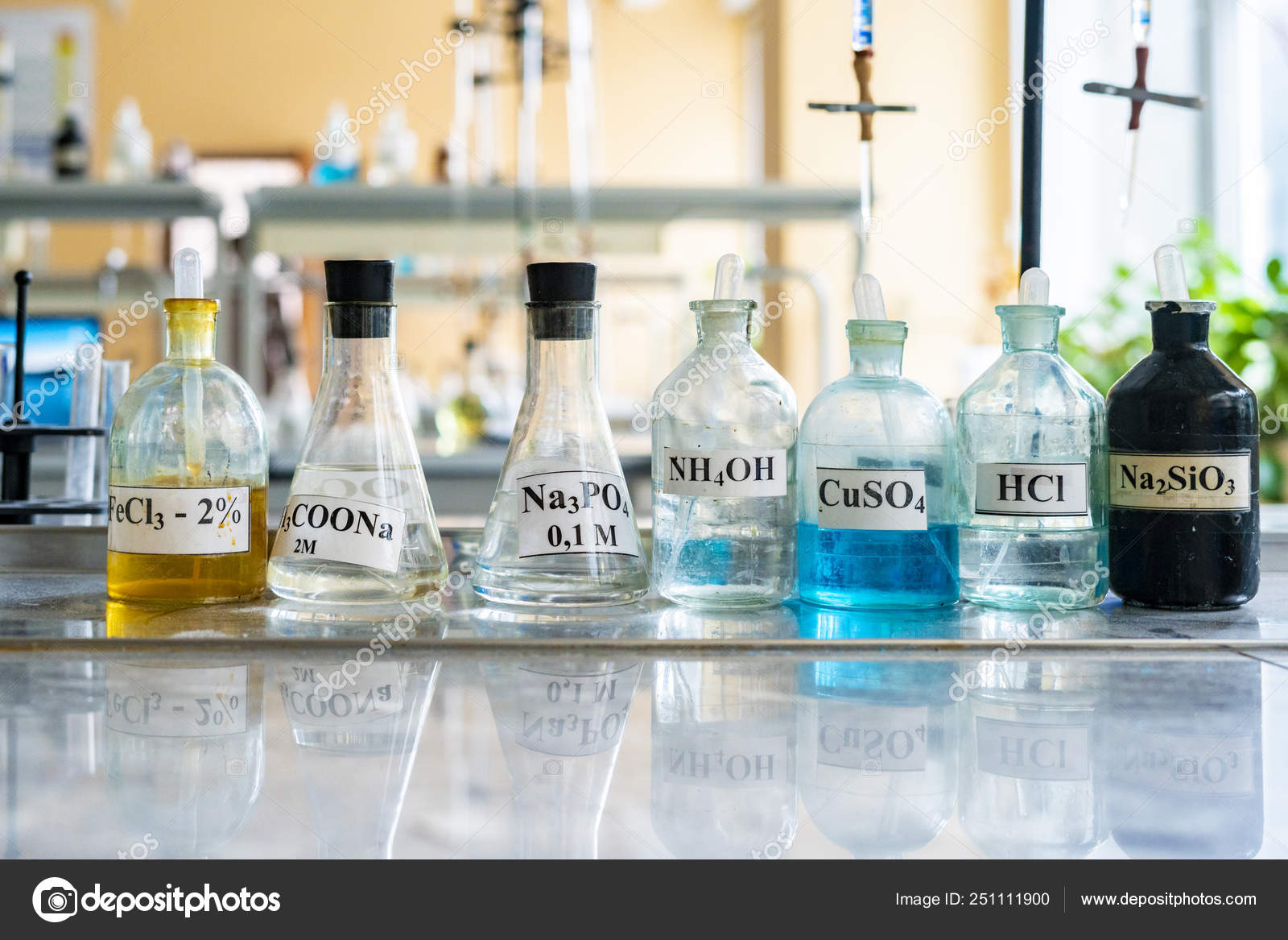 Chemical flasks with acid stand in laboratory b — Stock Photo ...