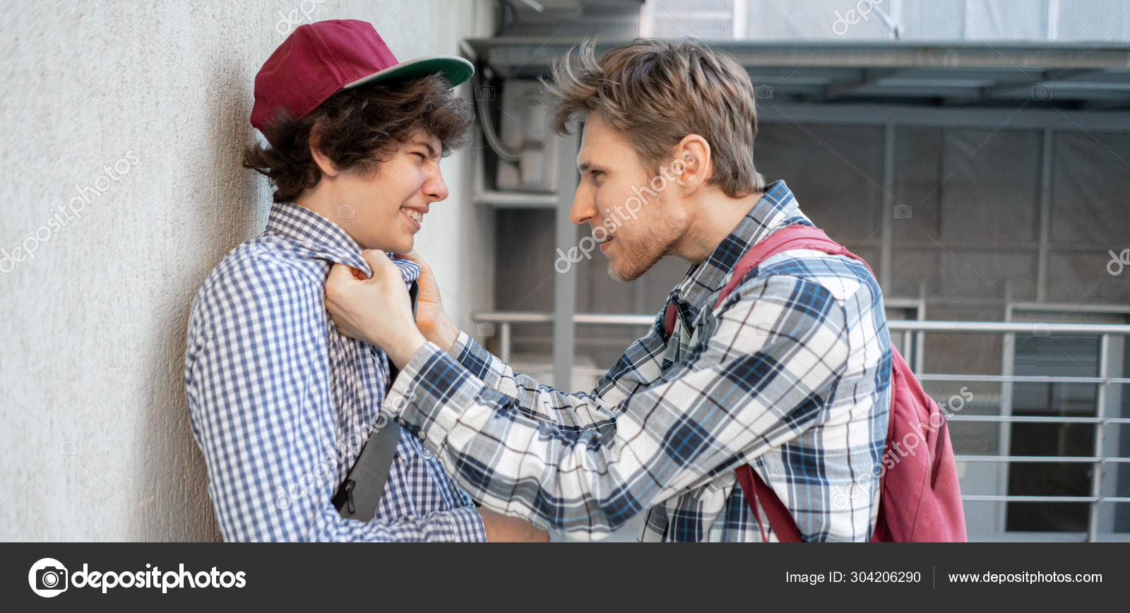 Two guys fight each other, one adult threaten to the student, push ...