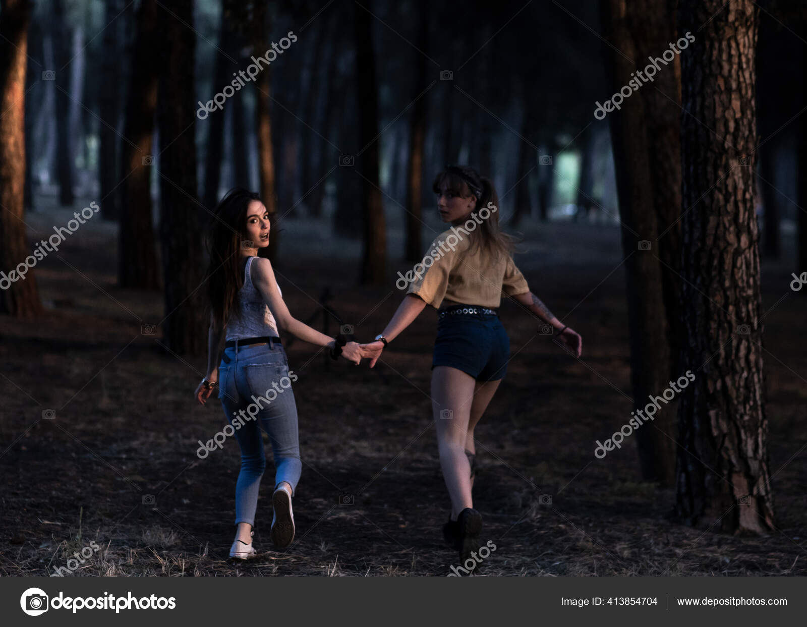 Two Girls Forest Flee Terrified — Stock Photo © Cavan #413854704