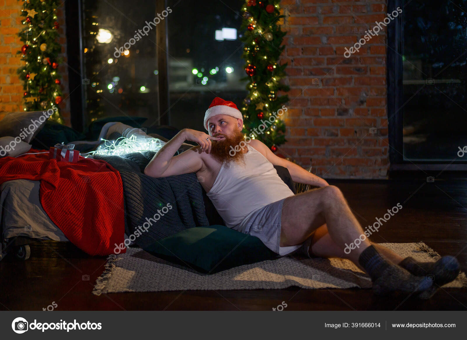 Humorous image of a man without pants in front of Christmas. Bald Santa ...