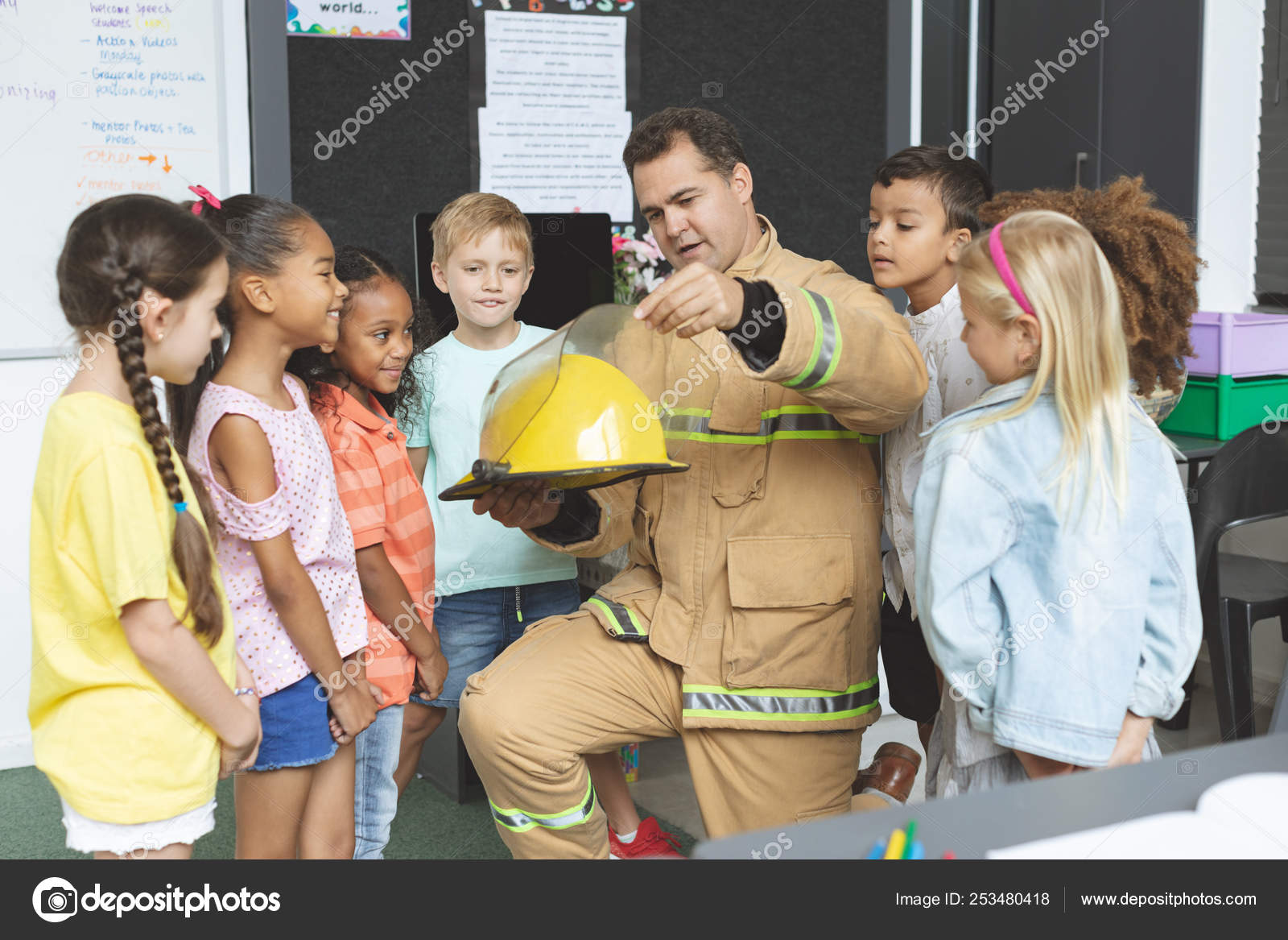 Front View Firefighter Teaching Student Fire Safety While Holding Fire ...