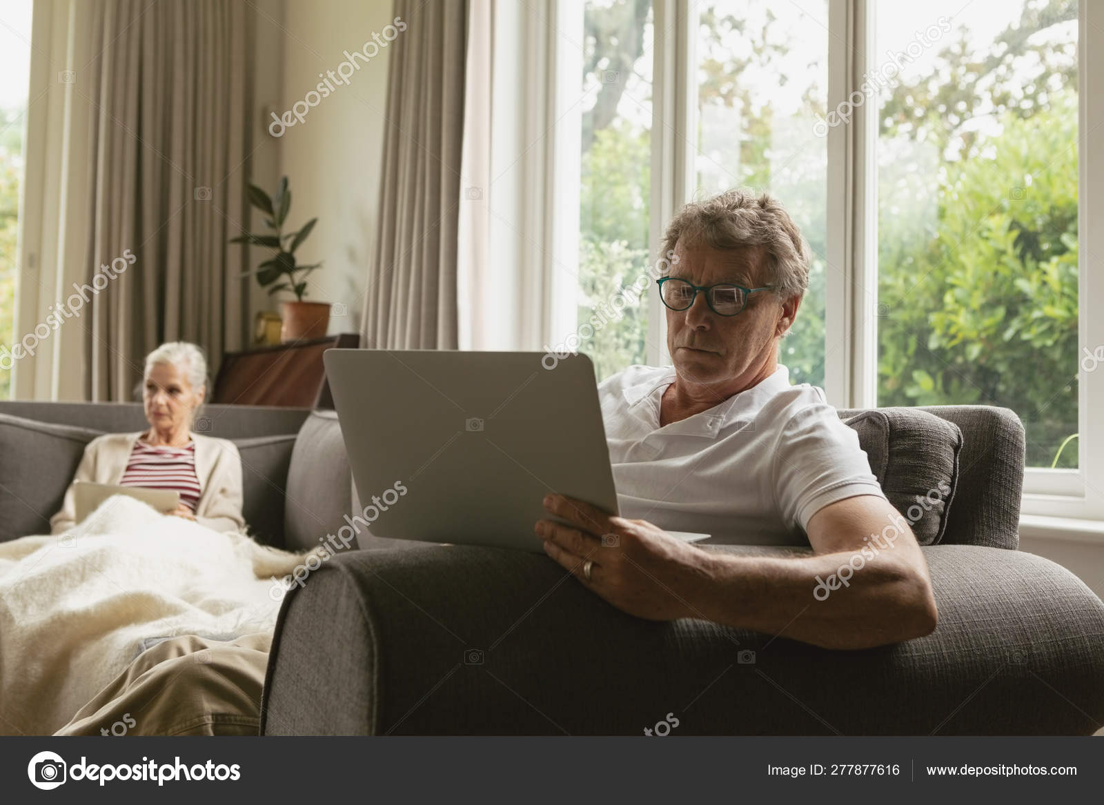 Front View Active Senior Caucasian Man Sitting Sofa Using Laptop Stock ...