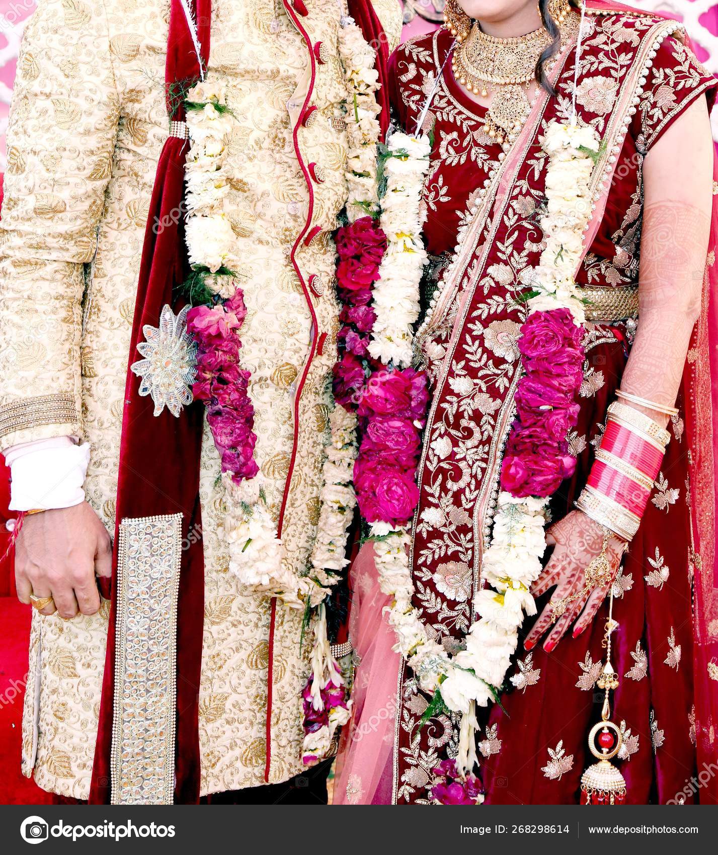 The bride and groom at the Indian wedding garlands or Jaimala ceremony ...