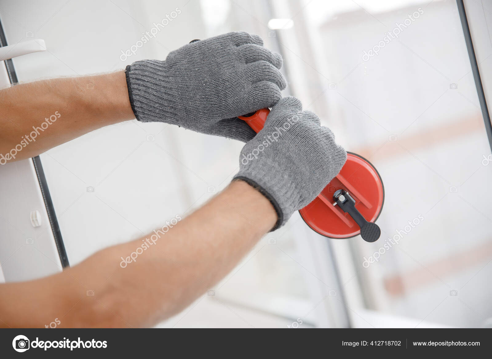 Worker man installs plastic windows and doors with double-glazed white ...