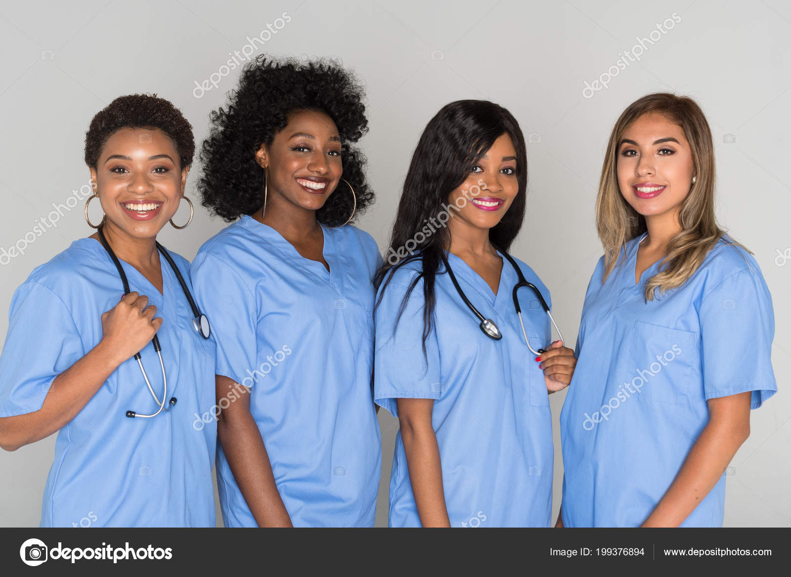 Large Group Female Nurses Working Together — Stock Photo © rmarmion ...