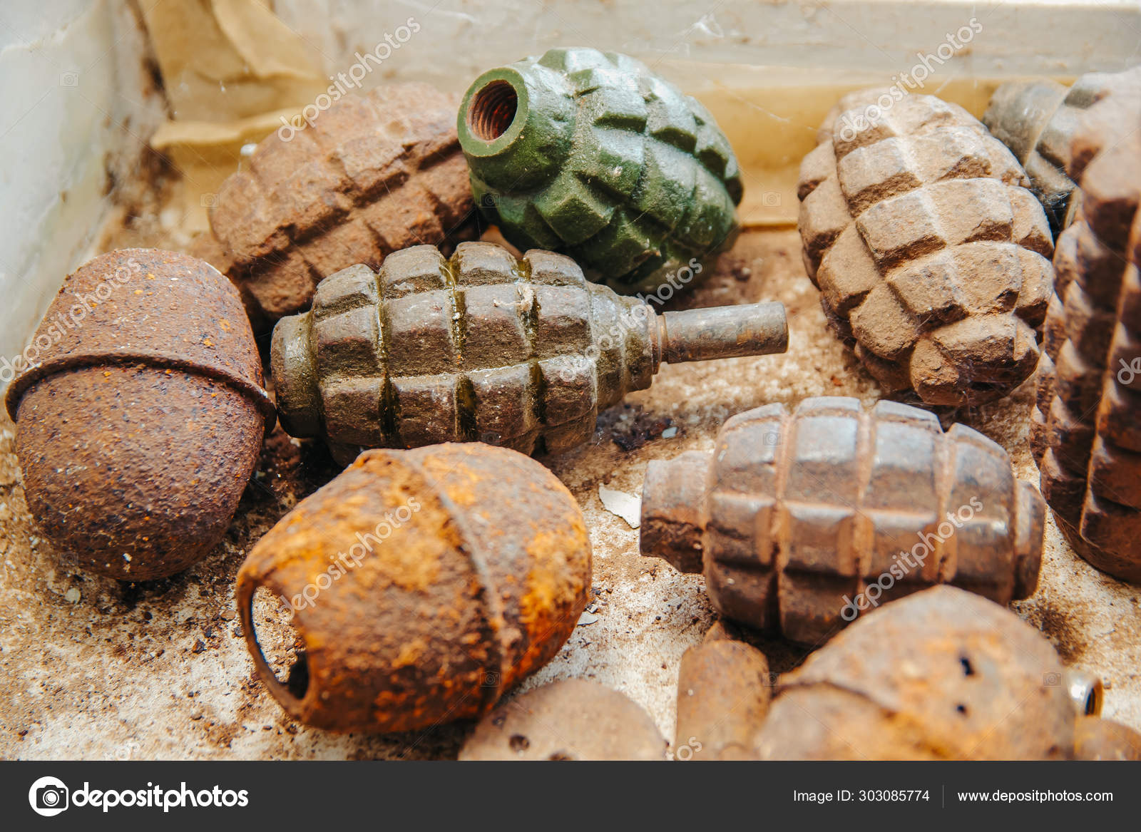 Old rusty grenades lying on the table — Stock Photo © andrew.glushenko ...