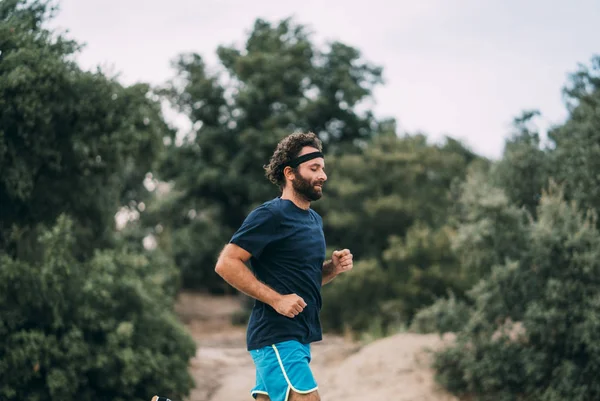 Classic vintage man does sport and runs in the field. - Stock Image ...